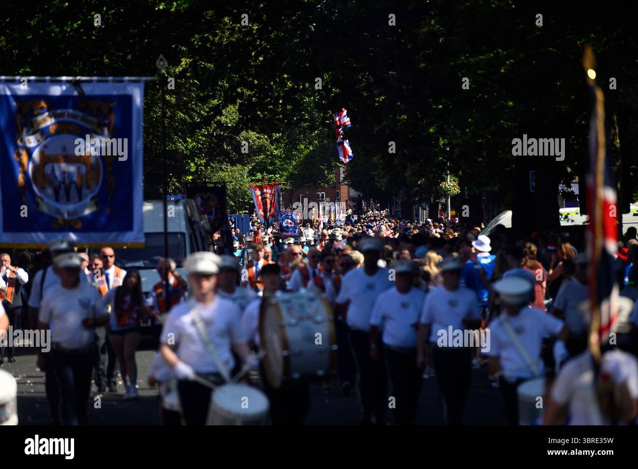 People take part in a Twelfth of July parade in Belfast, part of the ...