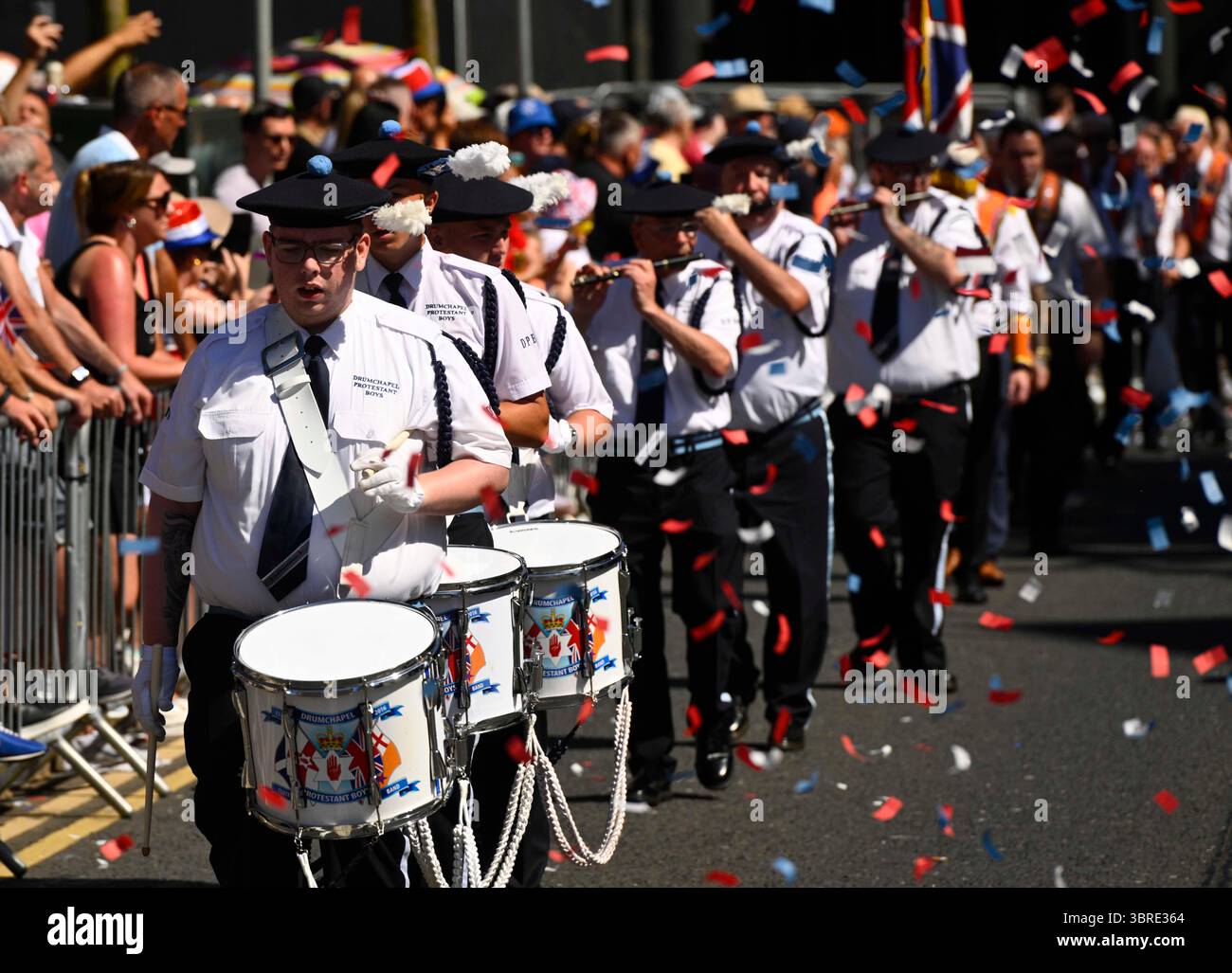 People take part in a Twelfth of July parade in Belfast, part of the ...