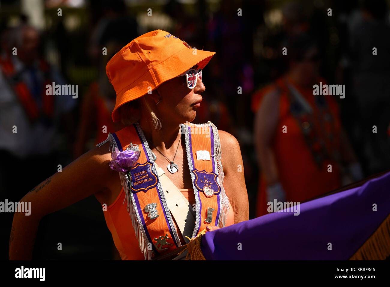 People take part in a Twelfth of July parade in Belfast, part of the ...