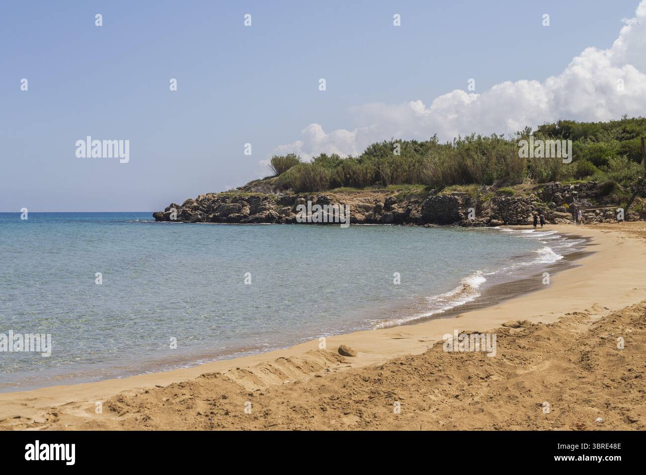 View of the tranquil beach with golden sand meeting the clear turquoise ...