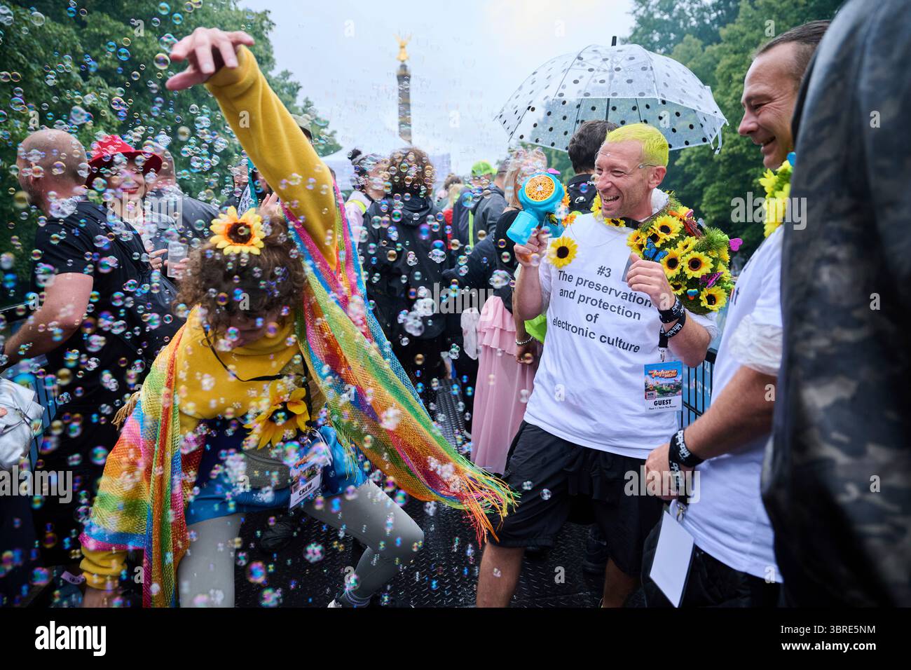 People dance to the music on DJ Dr. Motte's float, while thousands of ...