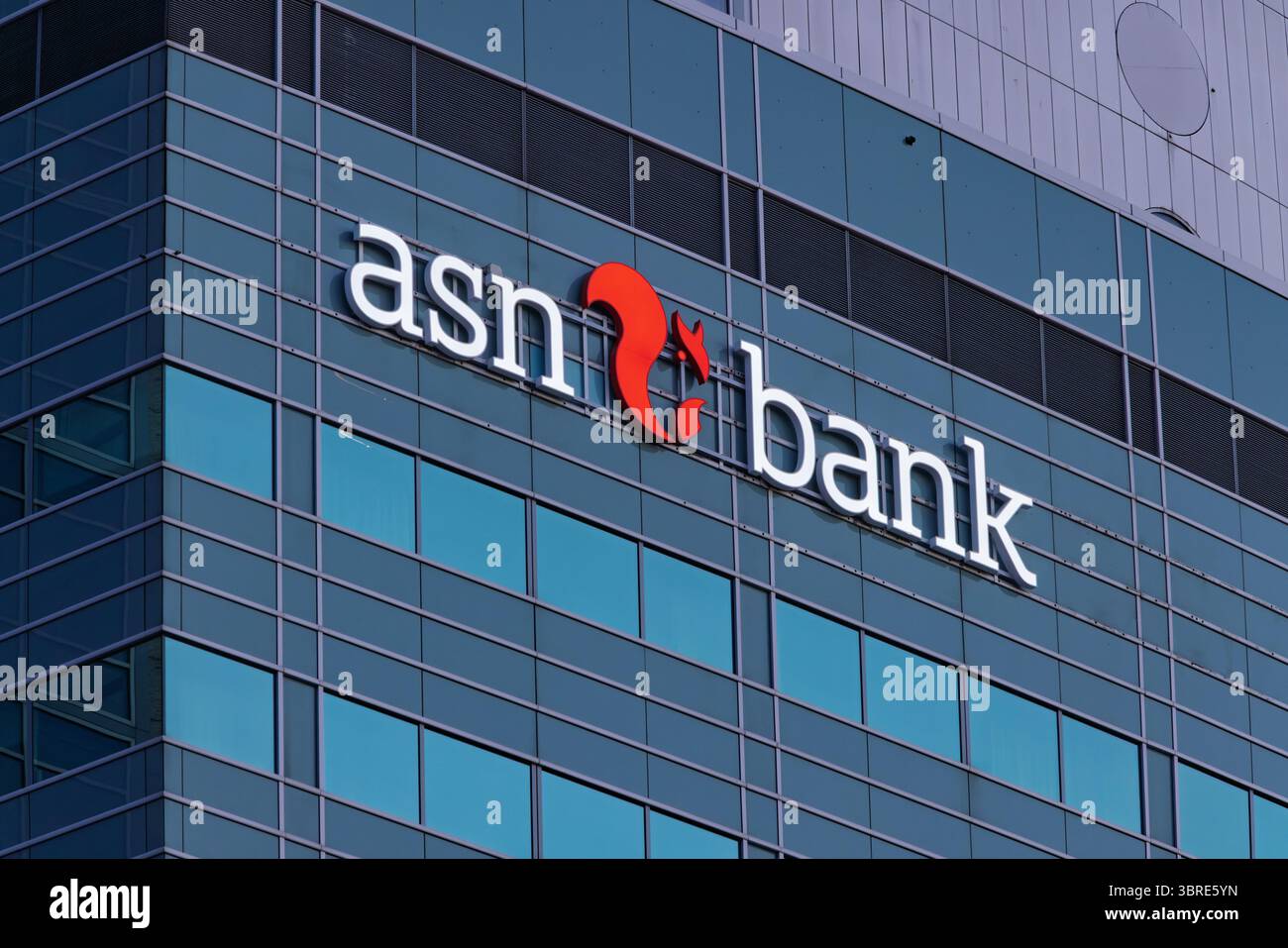 The logo of ASN Bank on the glass facade of a modern corporate building ...