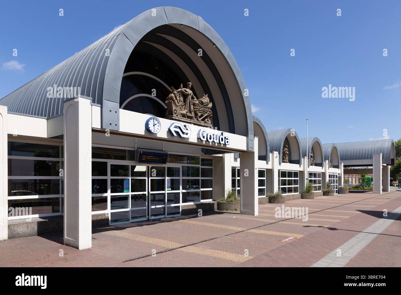 Modern Gouda train station exterior, showcasing its distinctive arched ...