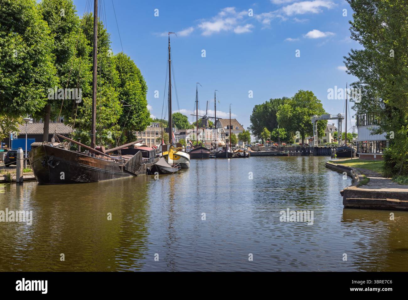 Scenic view of boats docked along the peaceful museum harbor in Gouda ...