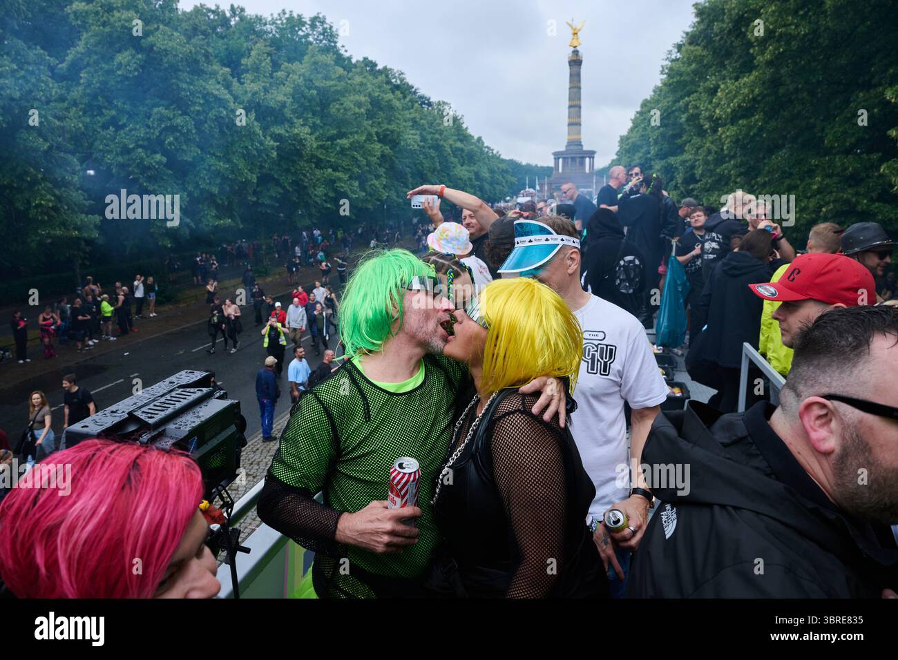 12 July 2025, Berlin: A couple kisses while dancing with thousands of ...