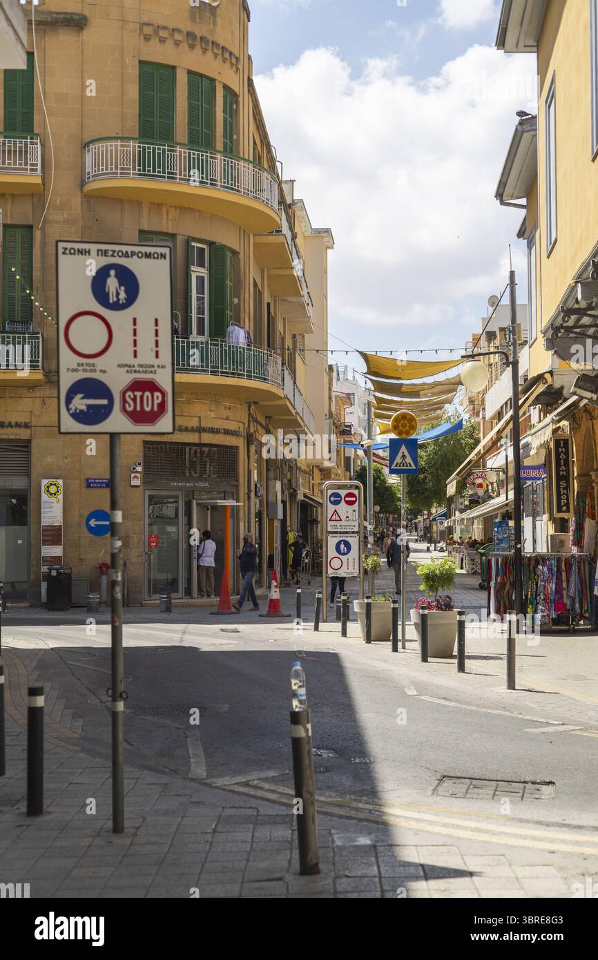 Lefkosia, Cyprus - 25 June 2025: View of a sun-drenched street corner ...