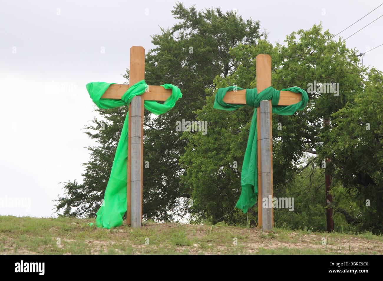 Kerrville, USA. 11th July, 2025. Two crosses with green ribbon in ...