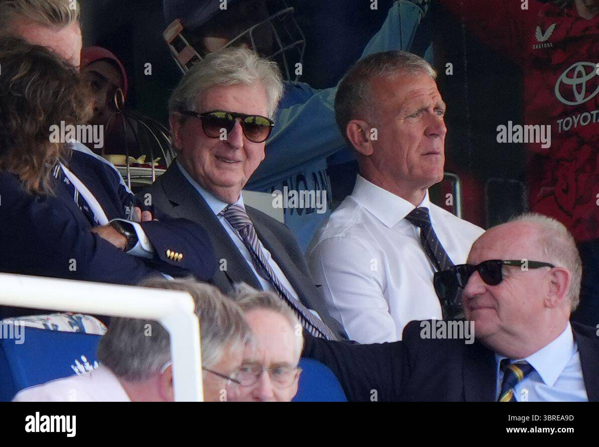 Former football manager Roy Hodgson (left) with former England and ...