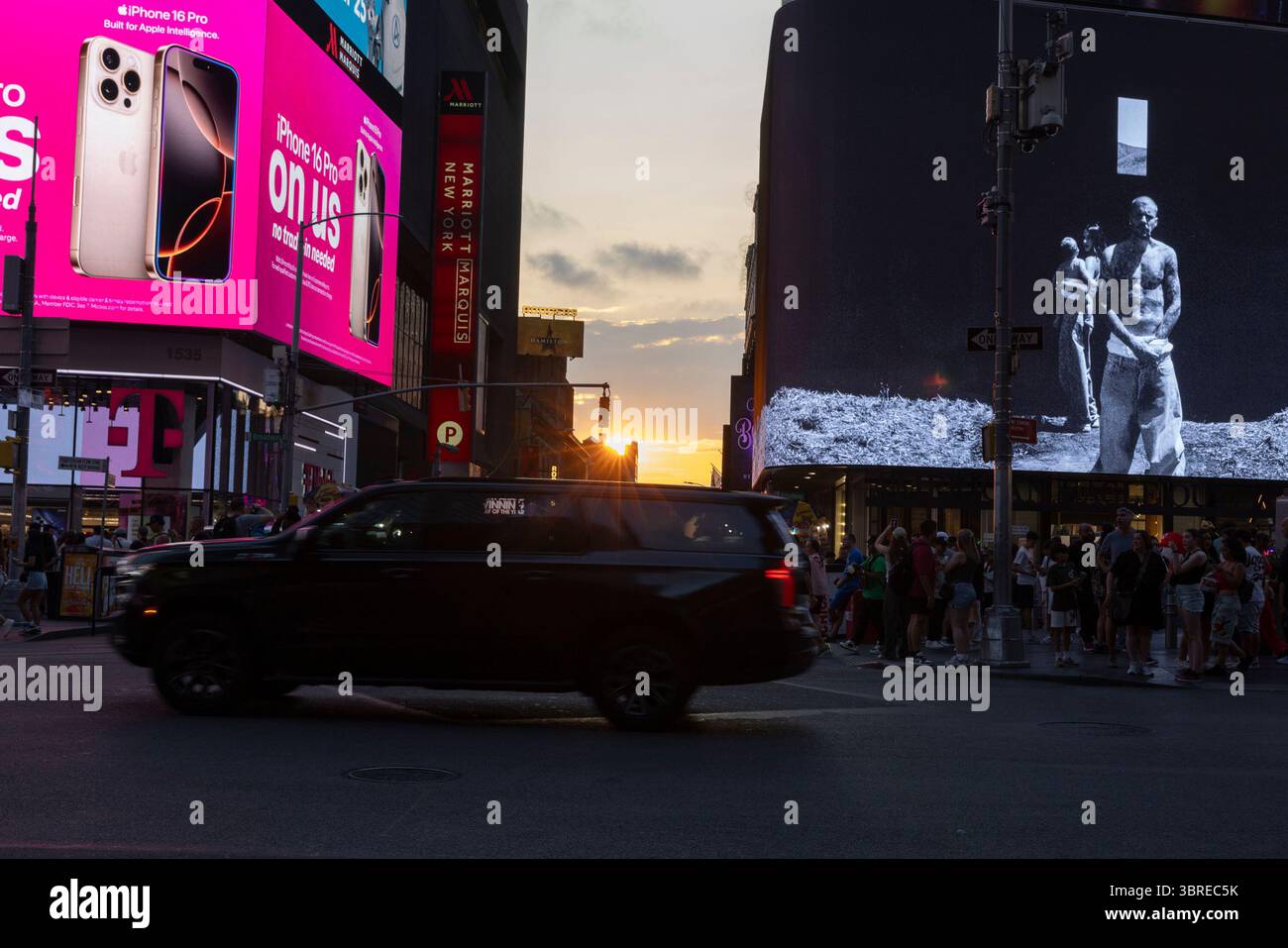 The second Manhattanhenge of the year is seen in Times Square in New ...
