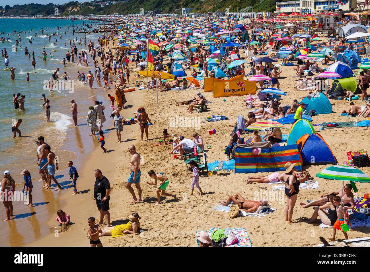 Bournemouth, Dorset UK. 12th July 2025. UK weather: crowds flock to ...
