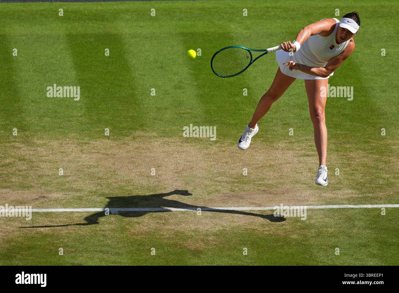 Amanda Anisimova of the U.S. serves to Iga Swiatek of Poland during the ...