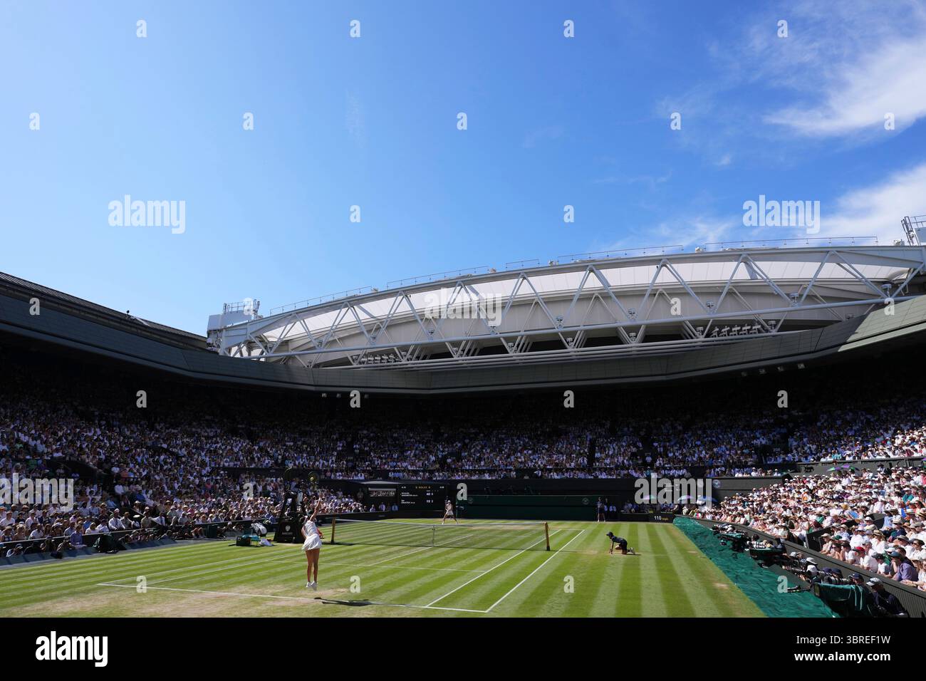 Amanda Anisimova of the U.S. serves to Iga Swiatek of Poland during the ...