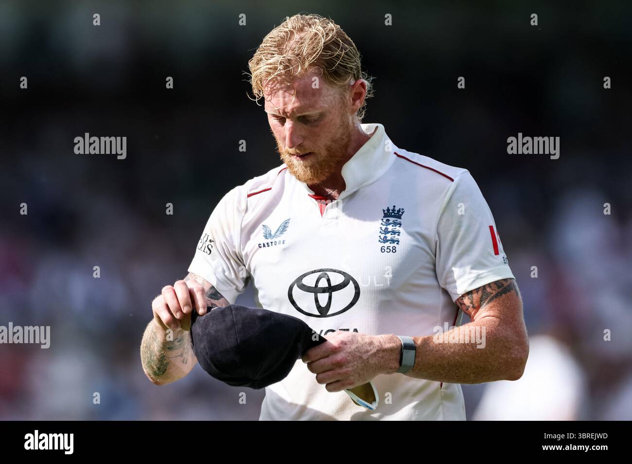 England captain Ben Stokes puts his cap on during the 3rd Rothesay Test ...