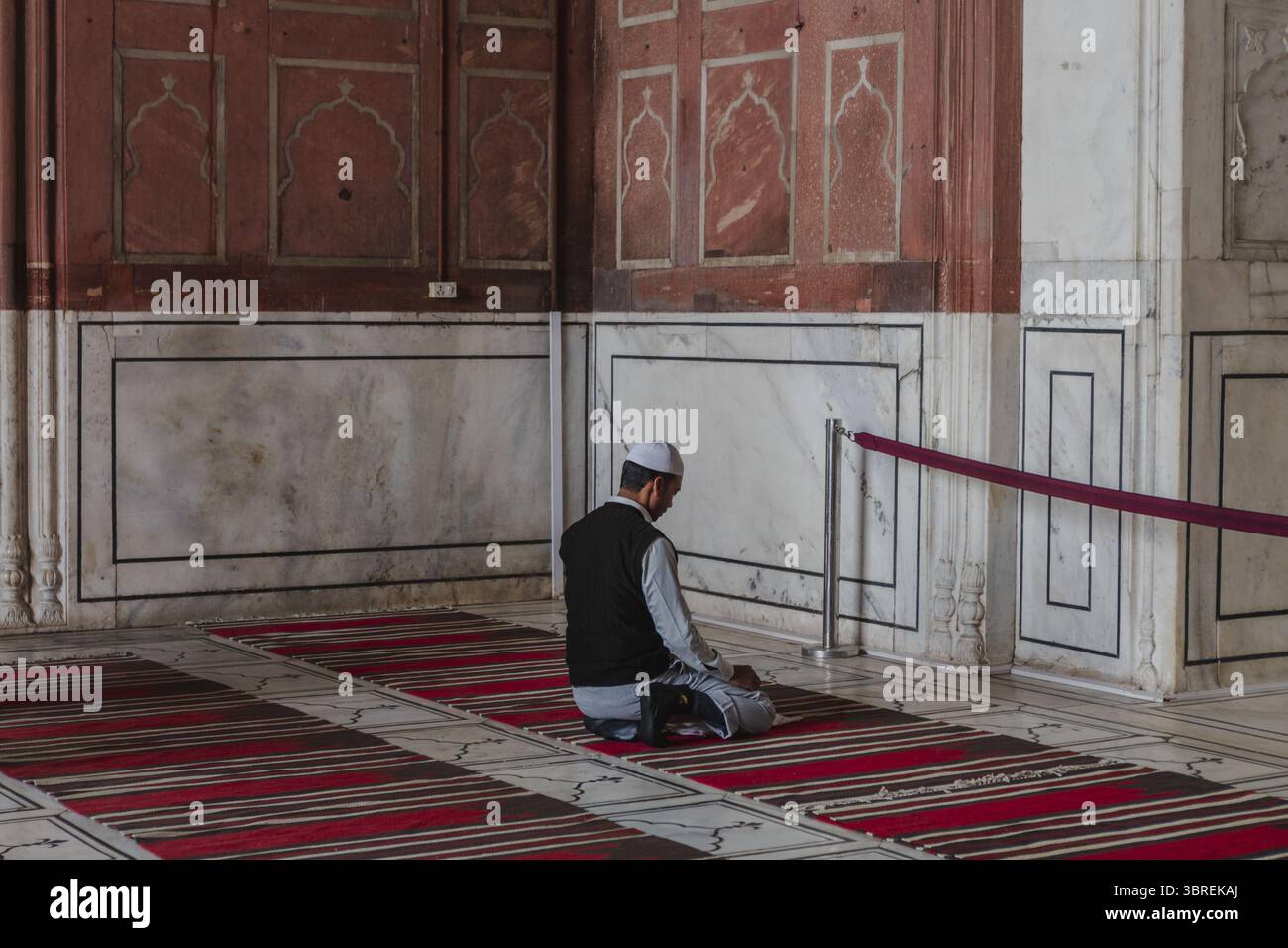 New Delhi, India - 24 June 2025: View of a man praying inside the Jama ...