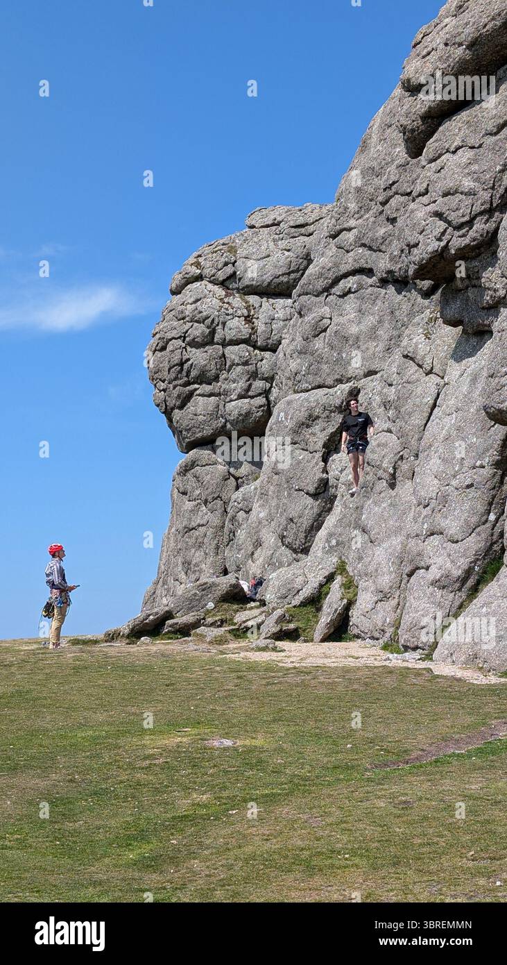 Dartmoor, UK - 19 June 2025 - Rock climbers at Haytor Rocks, Dartmoor ...