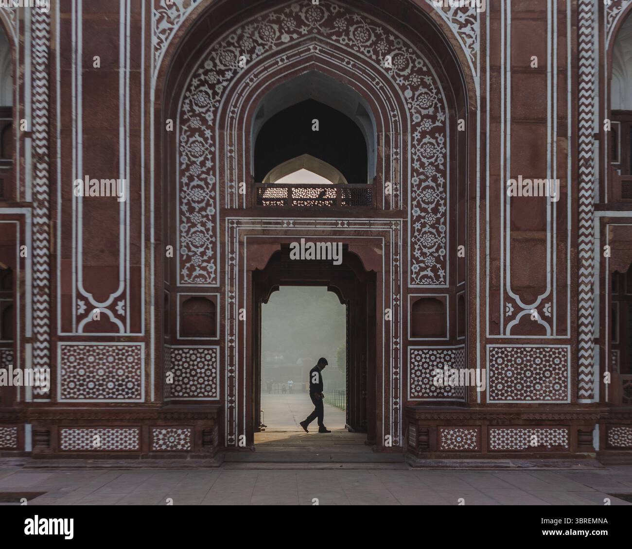 Agra, India - 24 June 2025: View of a lone figure walking through the ...