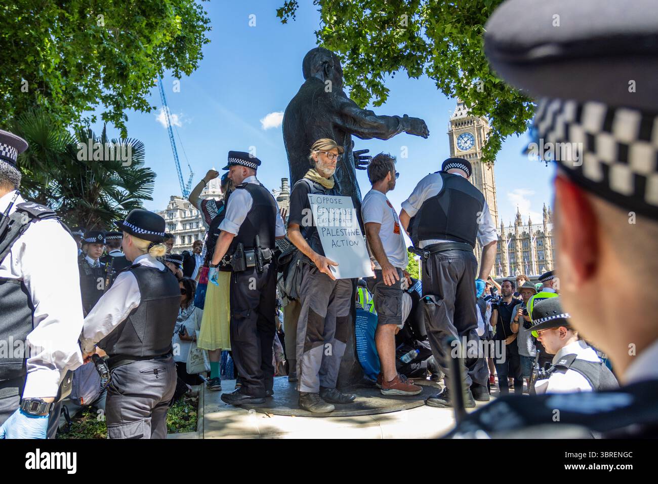 Pro-Palestine protesters and supporters of Palestine Action held up ...