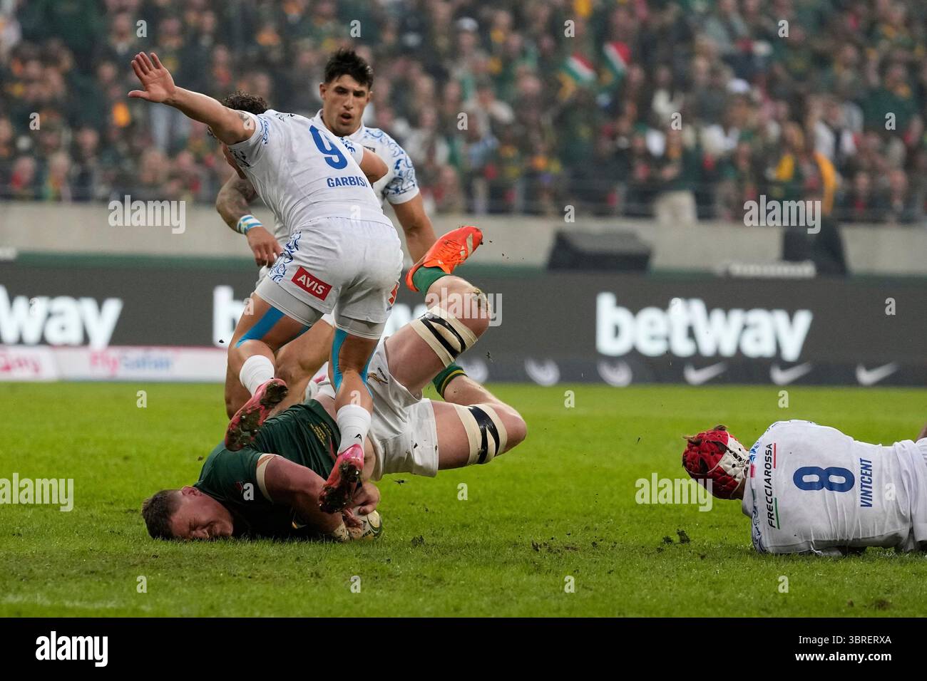 South Africa's Jasper Wiese, left, falls to the ground after by Italy's ...
