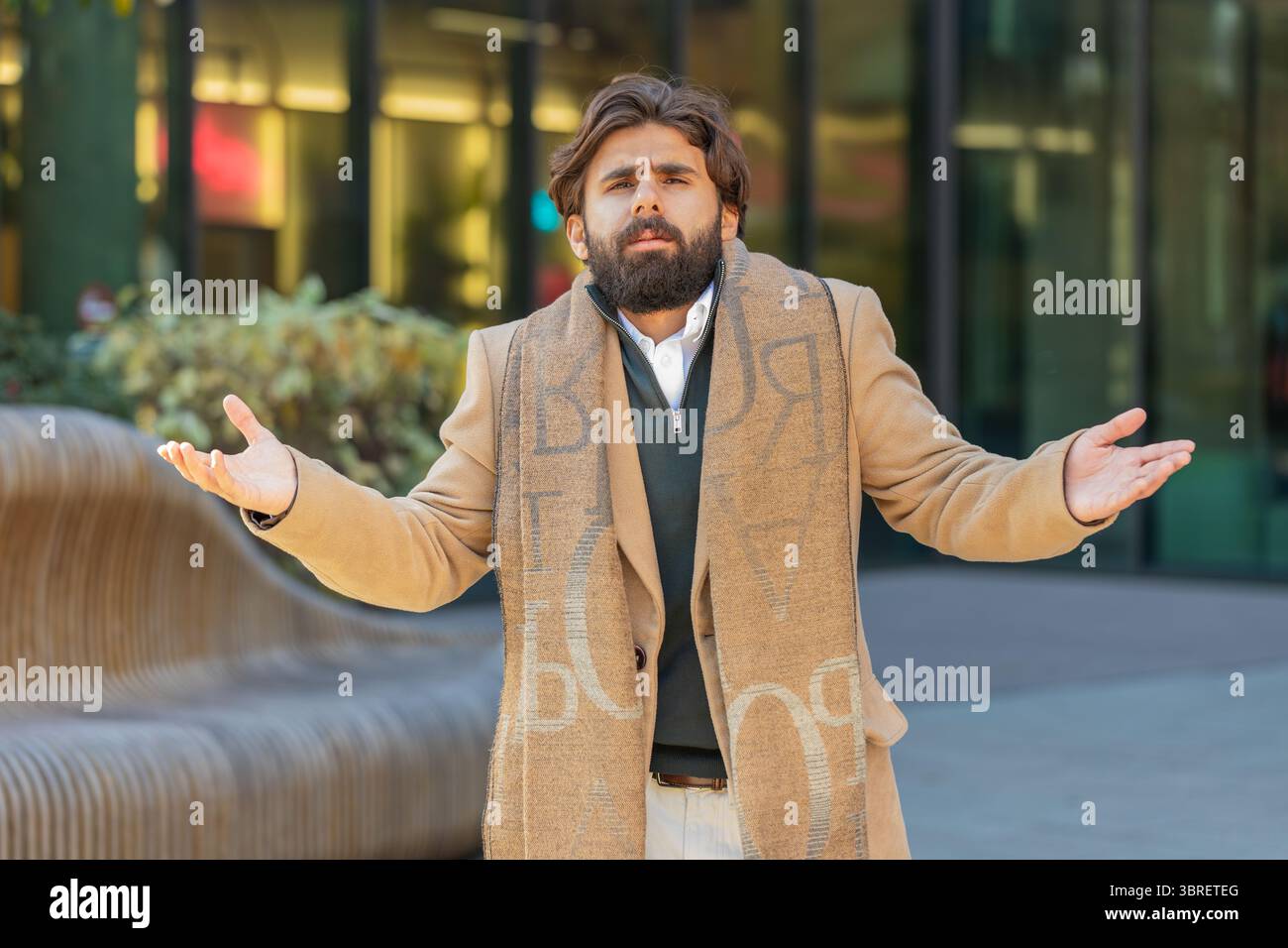 Doubtful sad frustrated Indian man tourist shrugging shoulders dont ...