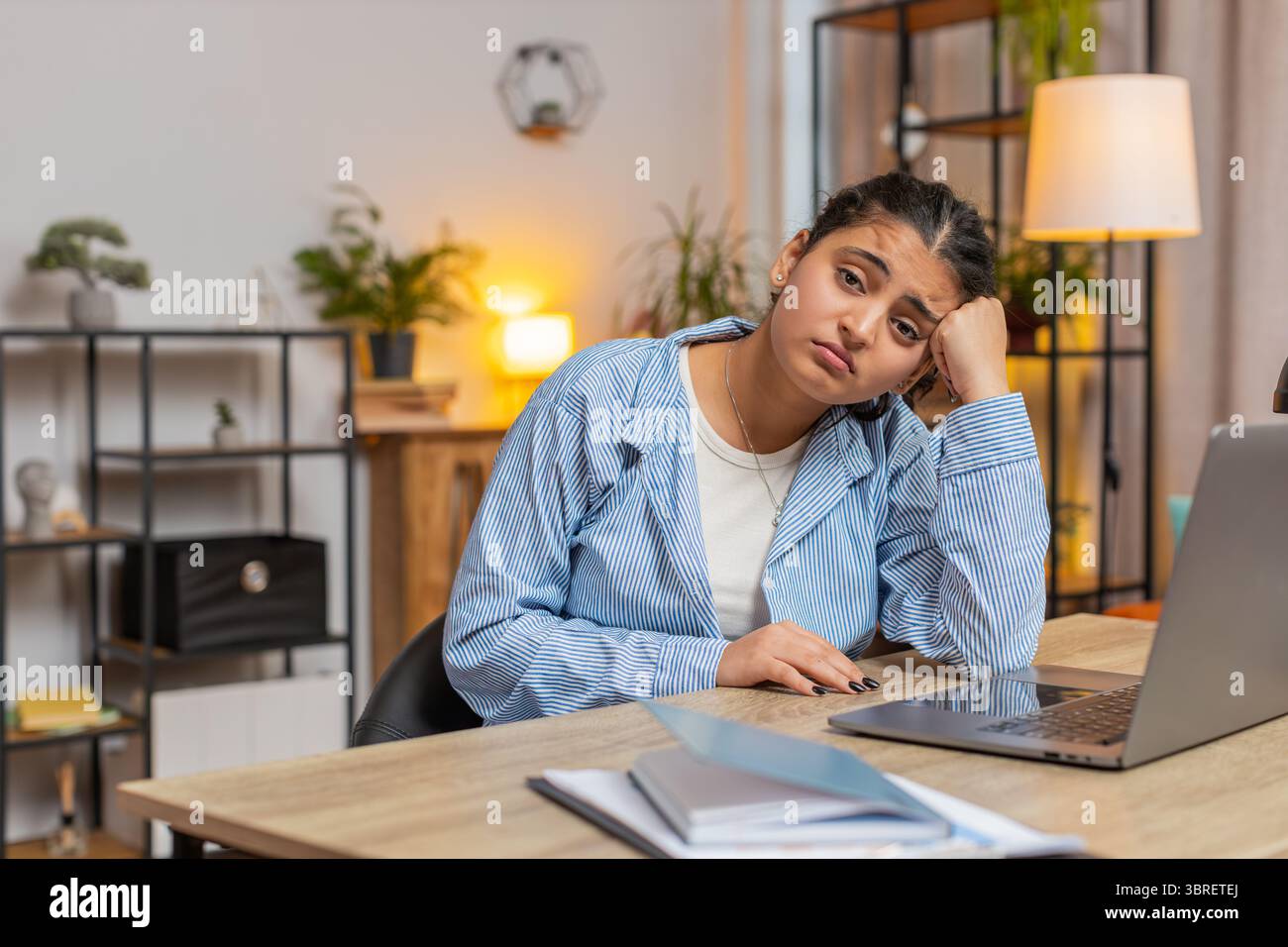 Sad Indian woman looks pensive thinks over life concerns or unrequited ...