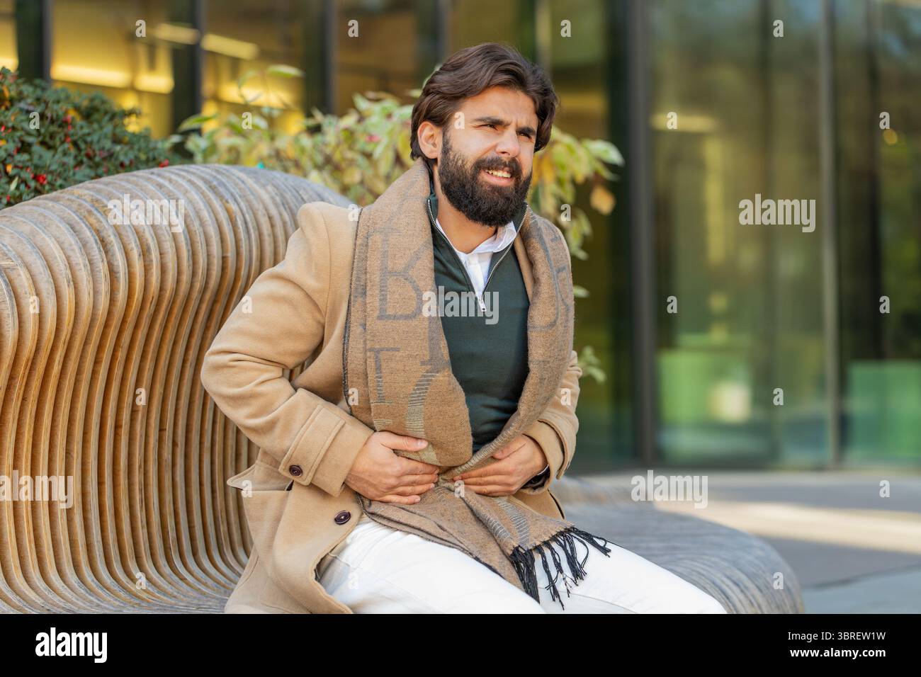 Indian business man feeling sudden strong abdominal stomach ache ...