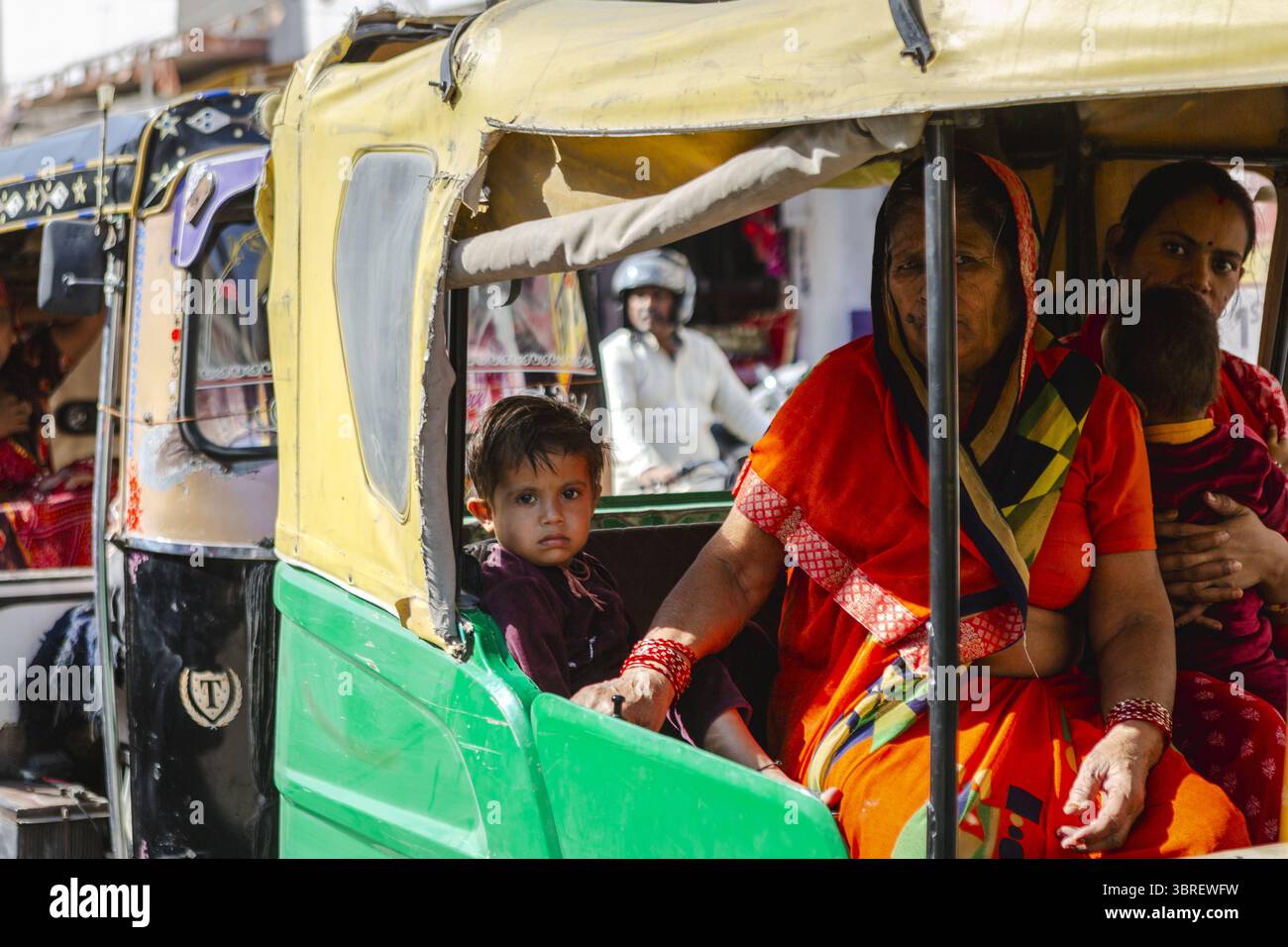 Bikaner, India - 24 June 2025: View of a vibrant green and yellow auto ...