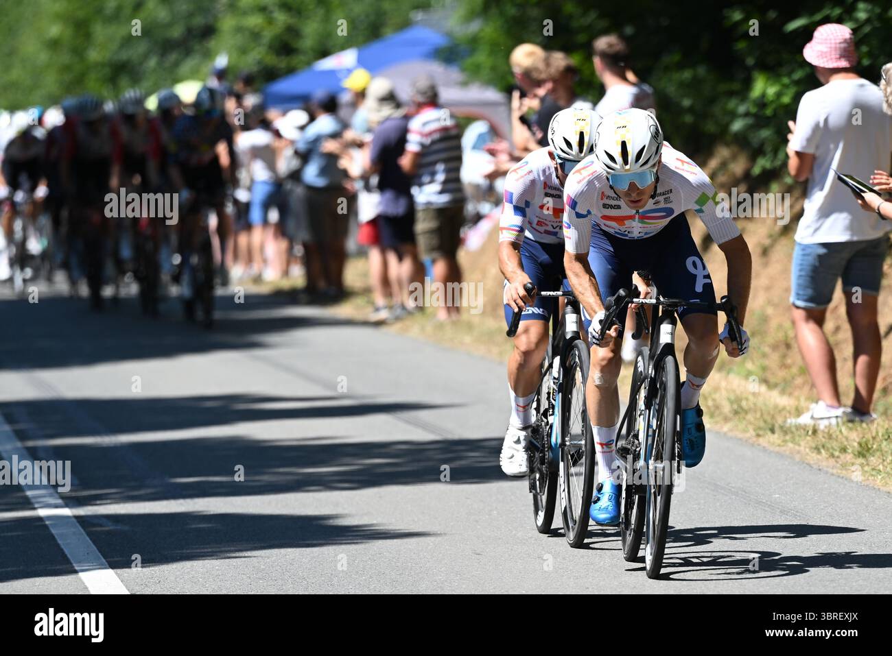 Tour de France 2025, Stage 8, Saint-Meen-Le-Grand to Laval Espace Mayenne. Two riders make a ...