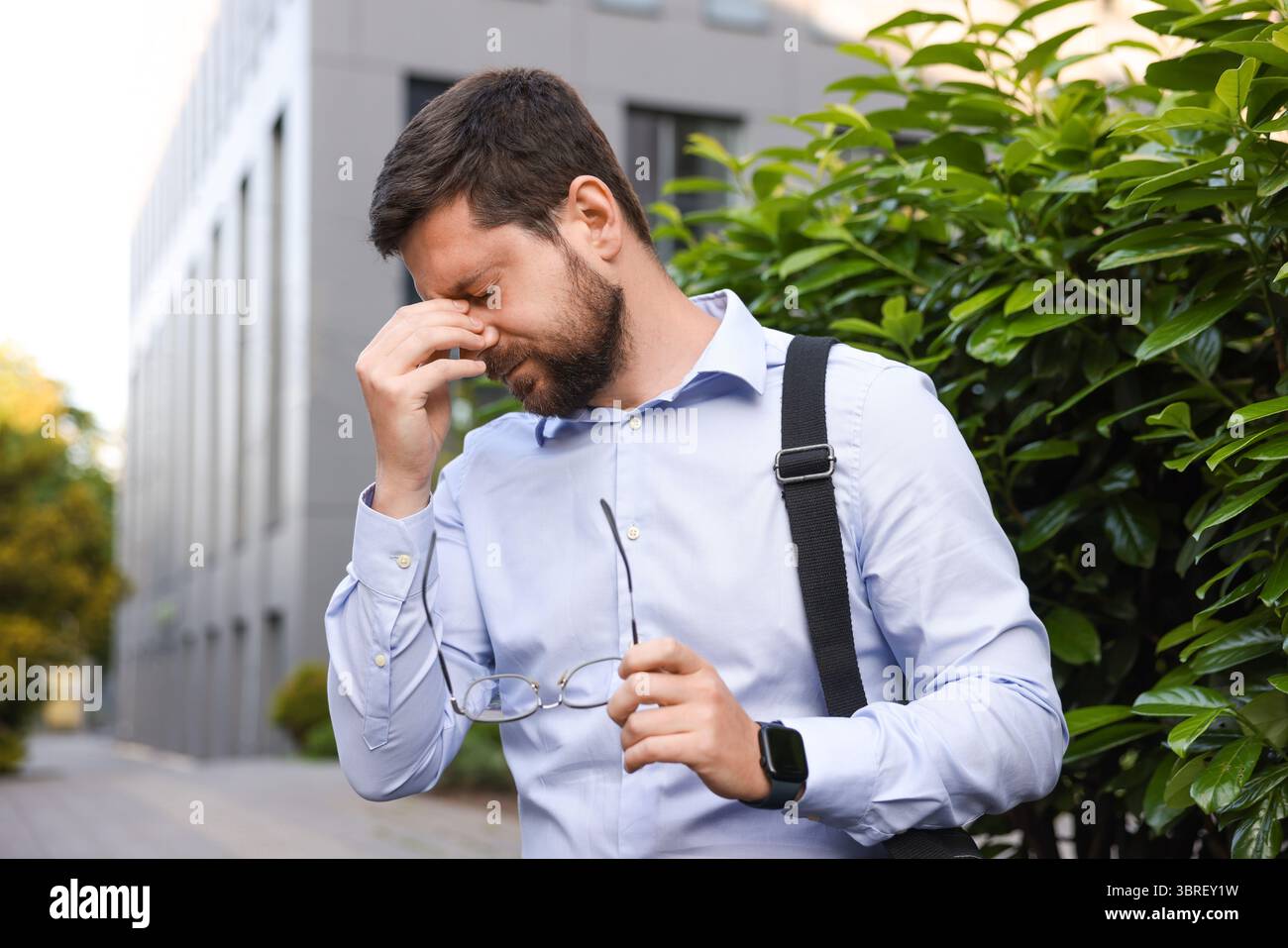 Tired businessman glasses outside hi-res stock photography and images ...