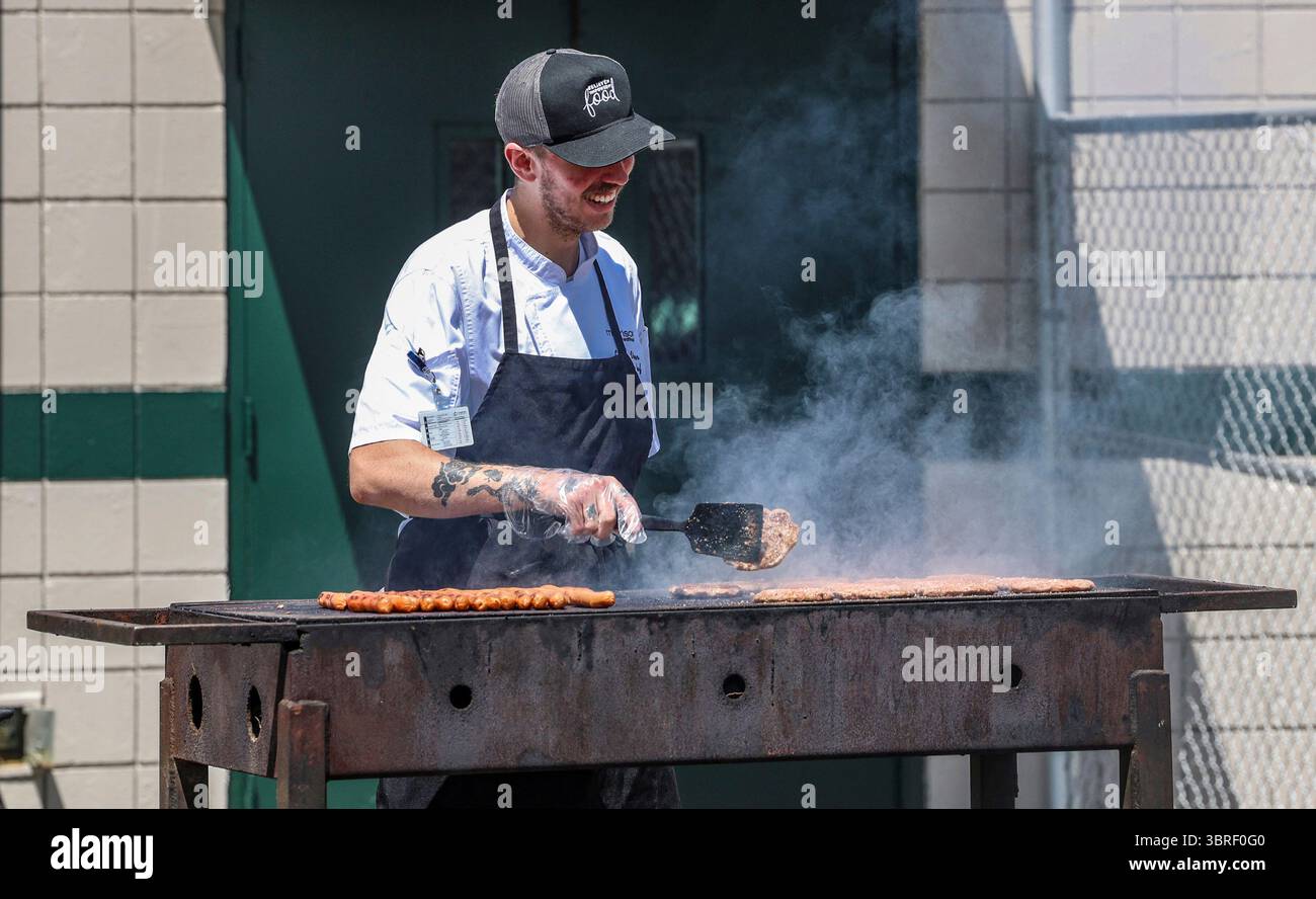 Ethan Vanover, executive chef at Owensboro Health, cooks burgers and ...
