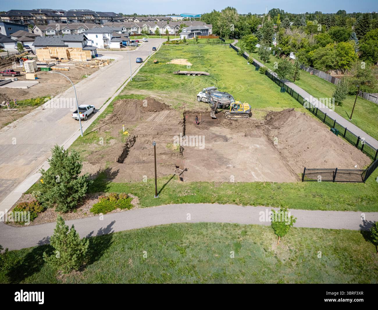 Construction site is visible in the background of a residential ...