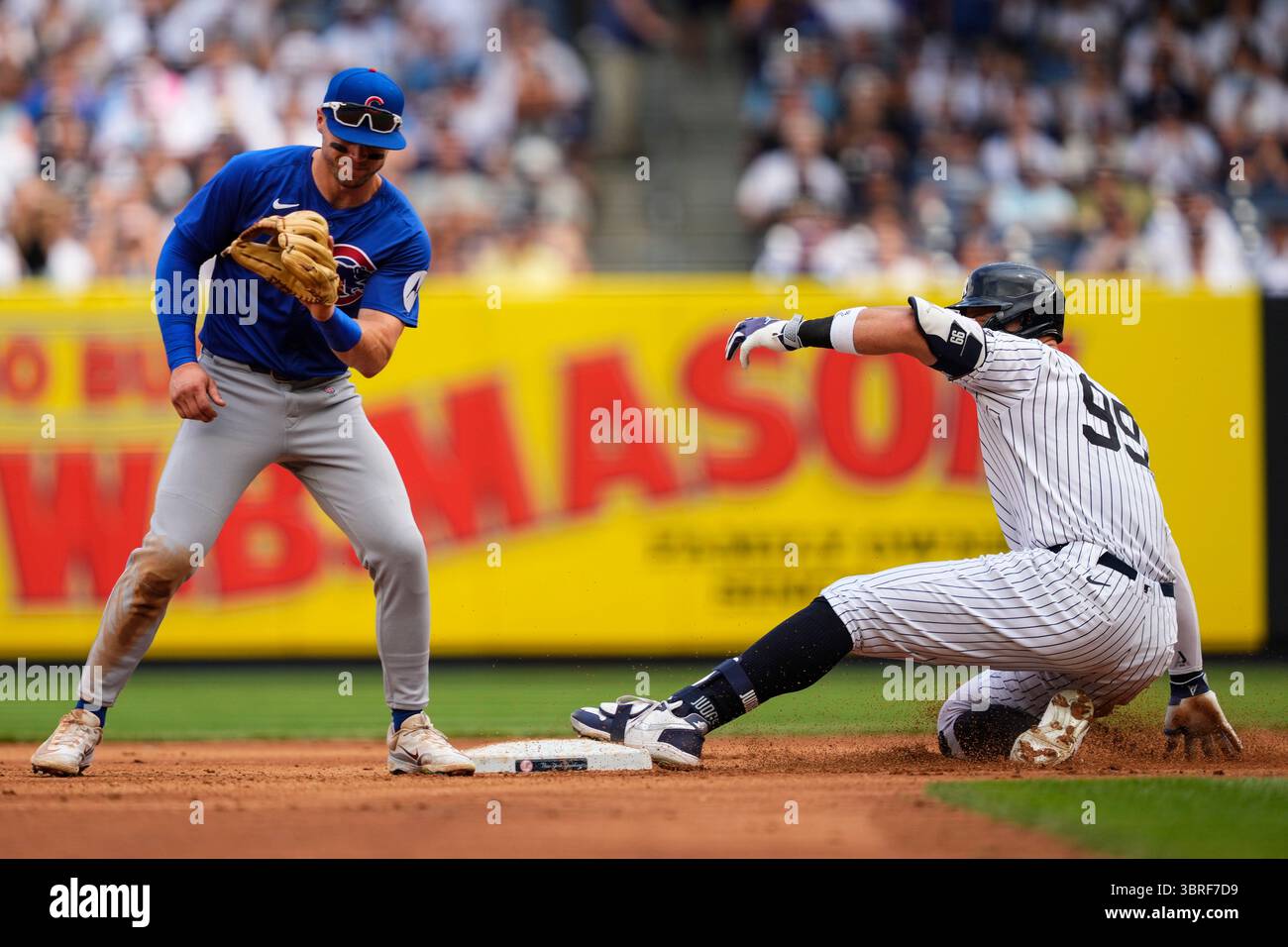 New York Yankees' Aaron Judge (99) slides into second base for a double ...