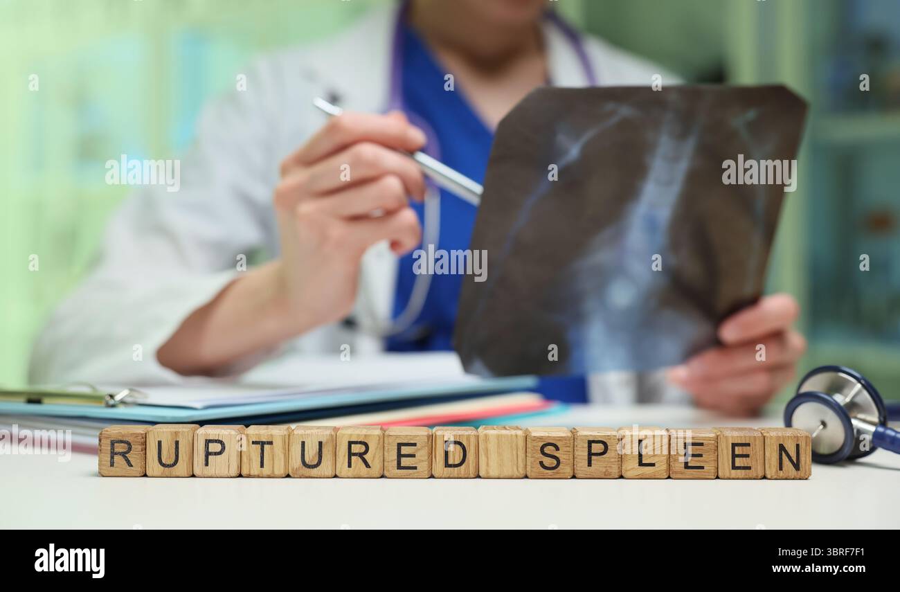 The doctor is carefully reviewing the Xray images to confirm a ...