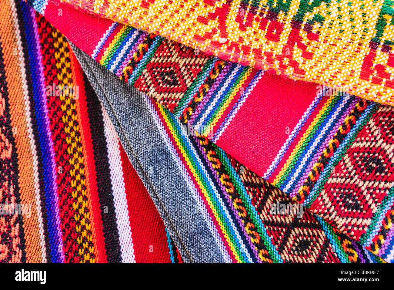 Colorful hand-woven Inca textile background with ancient designs from ...