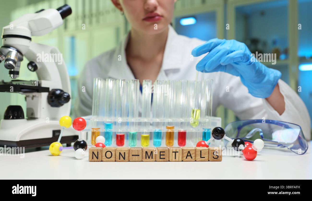 A scientist conducts nonmetal experiments in a lab, emphasizing ...