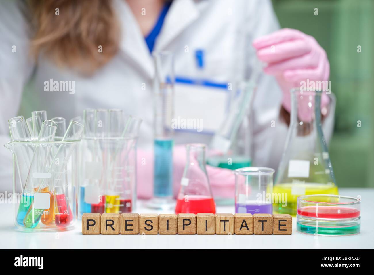 A scientist conducts experiments with colorful reagents to analyze ...