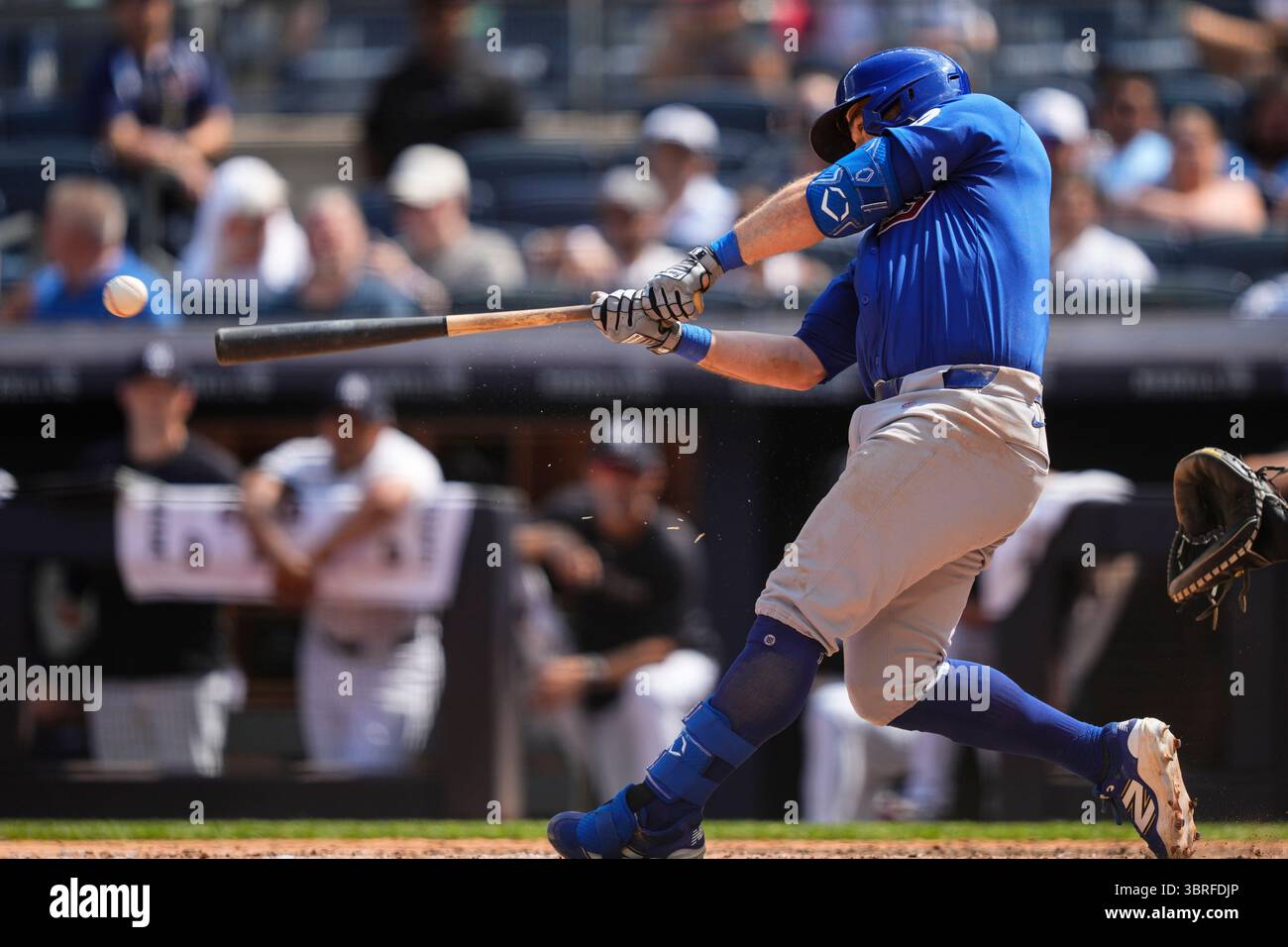 Chicago Cubs' Jon Berti (5) hits a single during the ninth inning of a ...