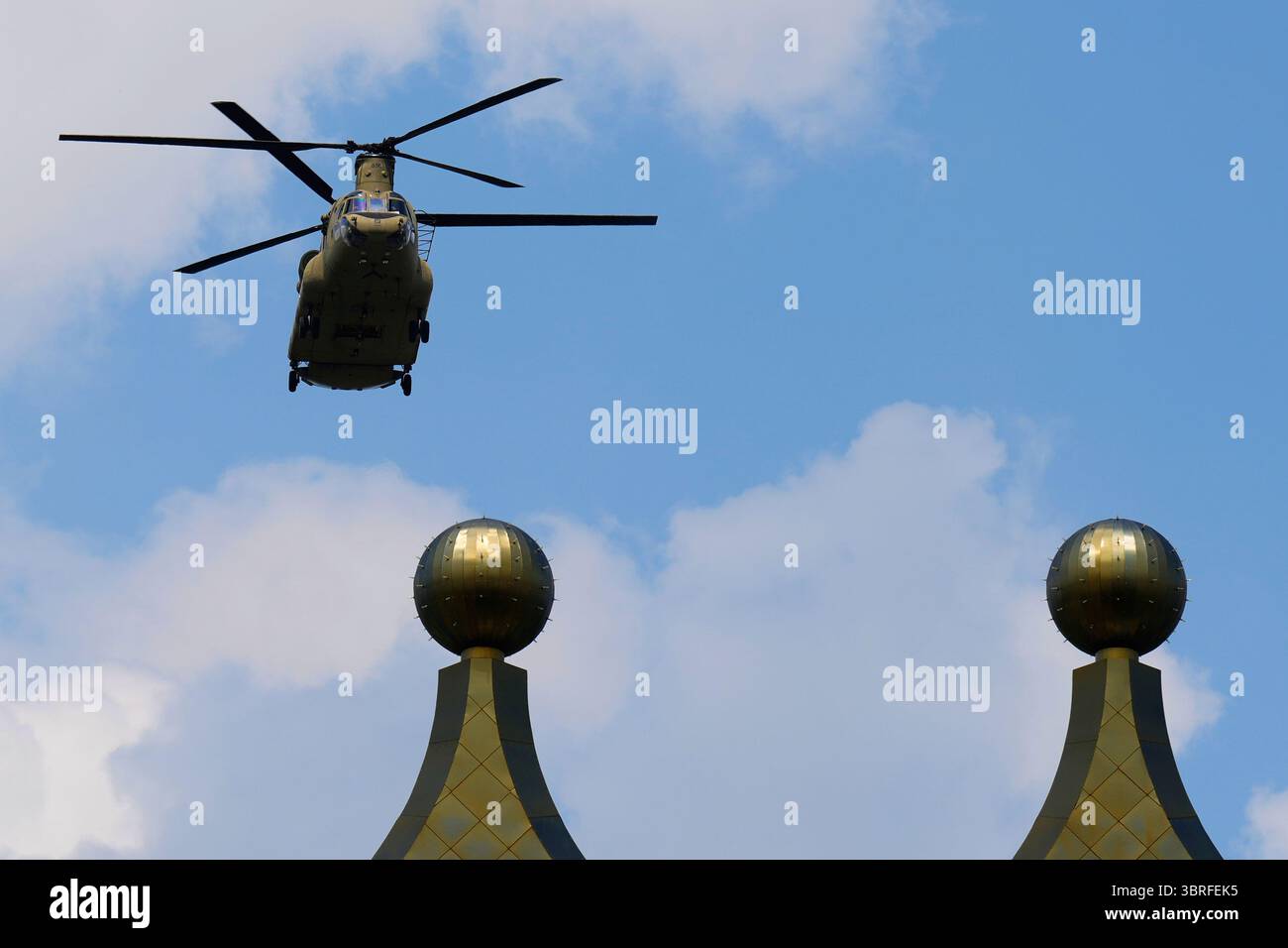 A military helicopter flies over Kauffman Stadium before a baseball ...