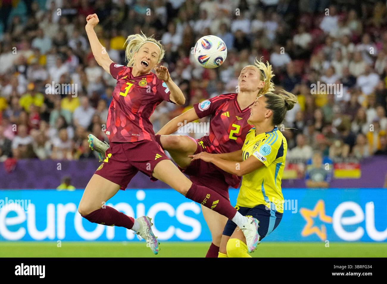 Germany's Kathrin Hendrich, left, and Sarai Linder vie for the ball ...