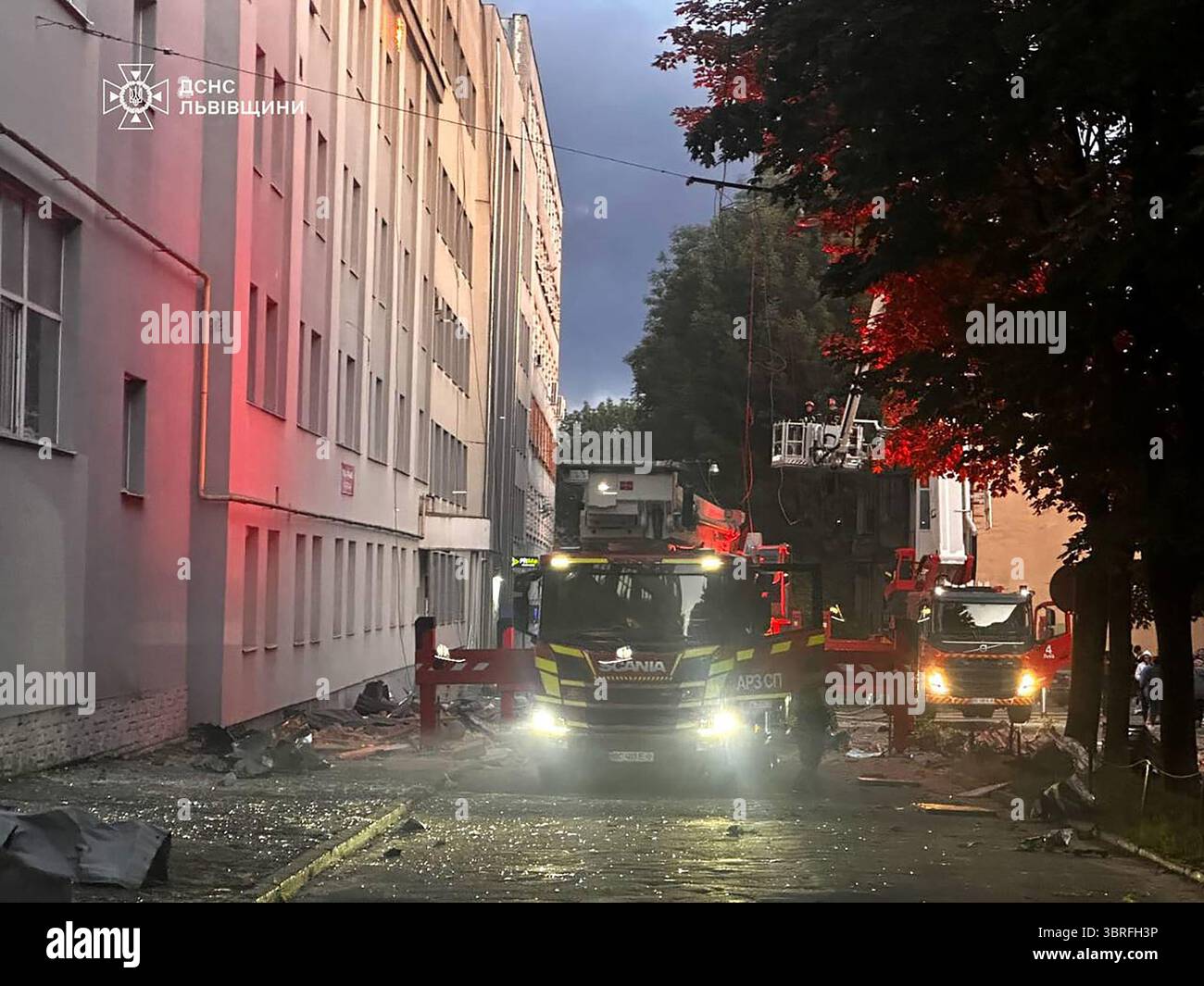 Ukrainian firefighters work to extinguish a fire following mass Russian ...