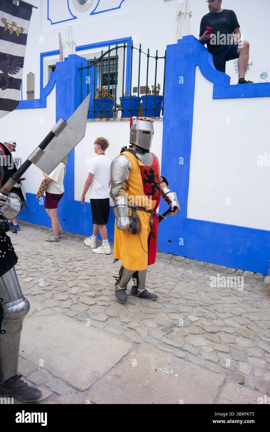 Medieval Market of Óbidos, Portugal, a procession with participants ...