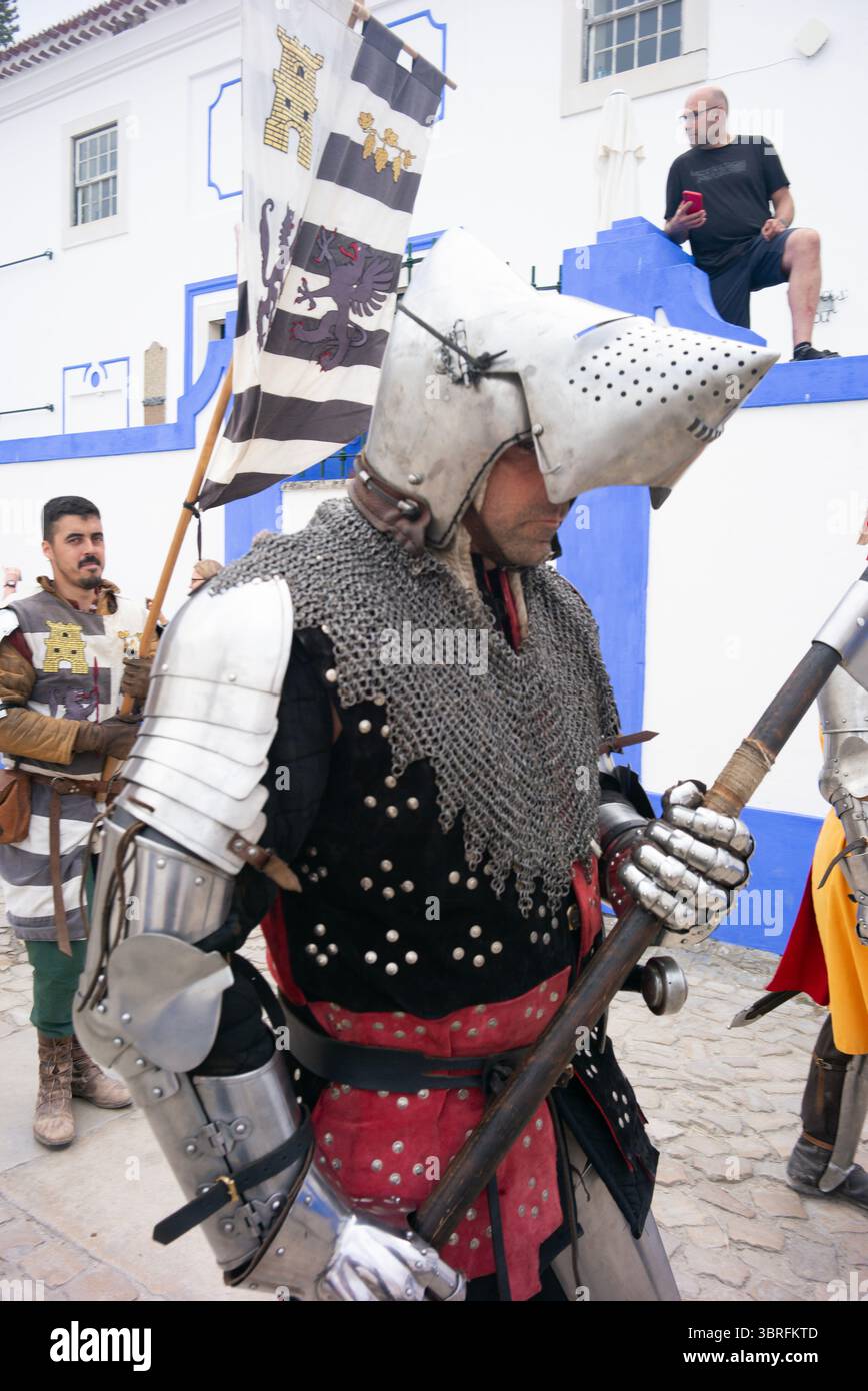 Medieval Market of Óbidos, Portugal, a procession with participants ...
