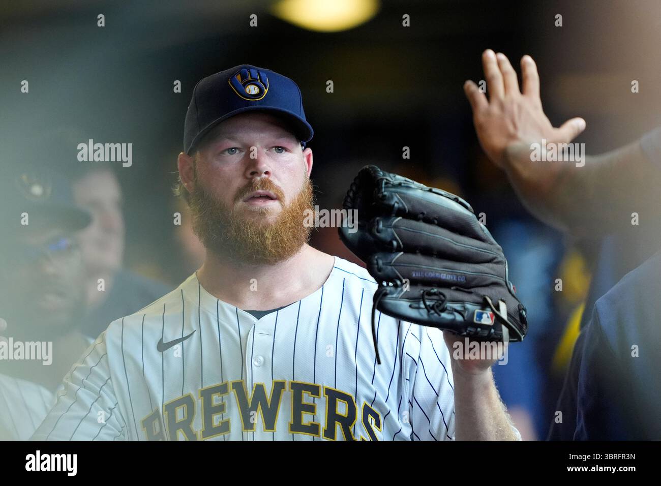 Milwaukee Brewers' Brandon Woodruff is congratulated in the dugout ...