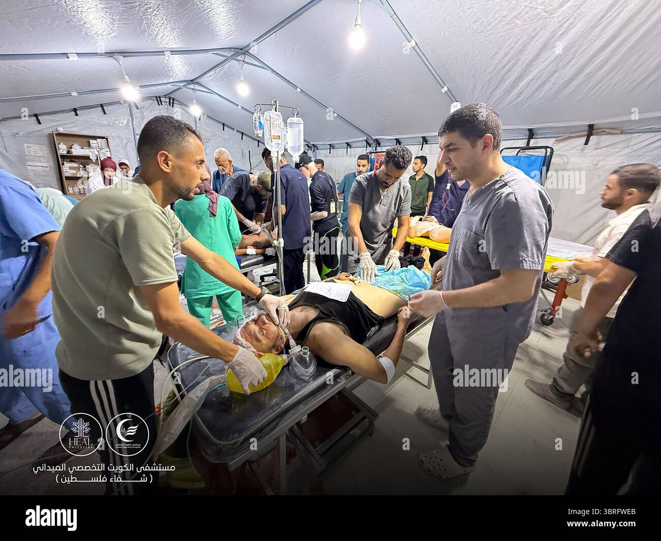 Medics at Specialized Field Kuwaiti Hospital rush to evacuate and treat ...