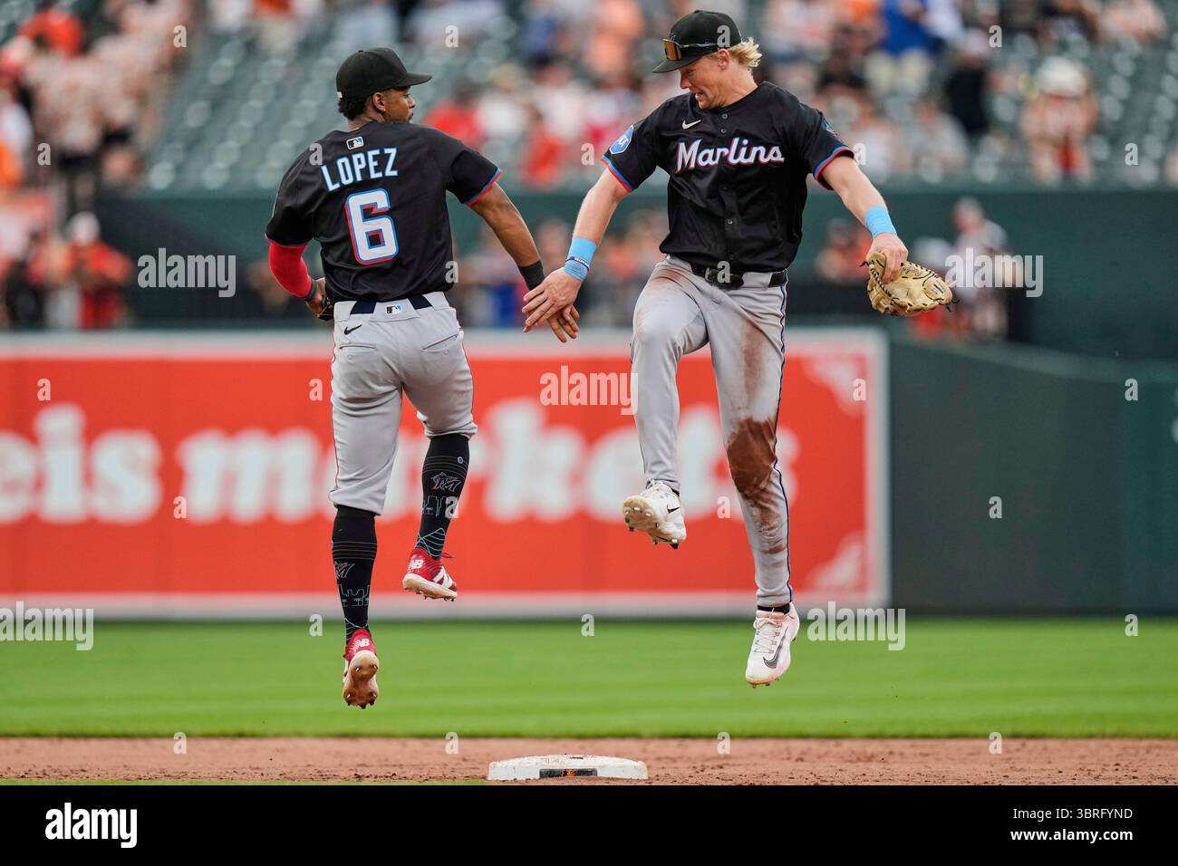 Miami Marlins shortstop Otto Lopez (6) and Miami Marlins right fielder ...