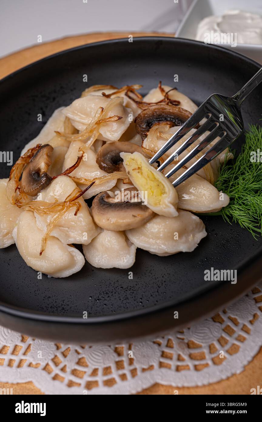 Classic potato dumplings with fried toppings Stock Photo - Alamy