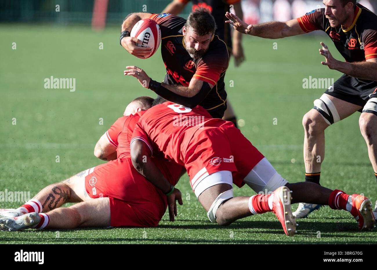 Canada's Kyle Steeves, left, and Matthew Oworu, center bottom, tackle ...