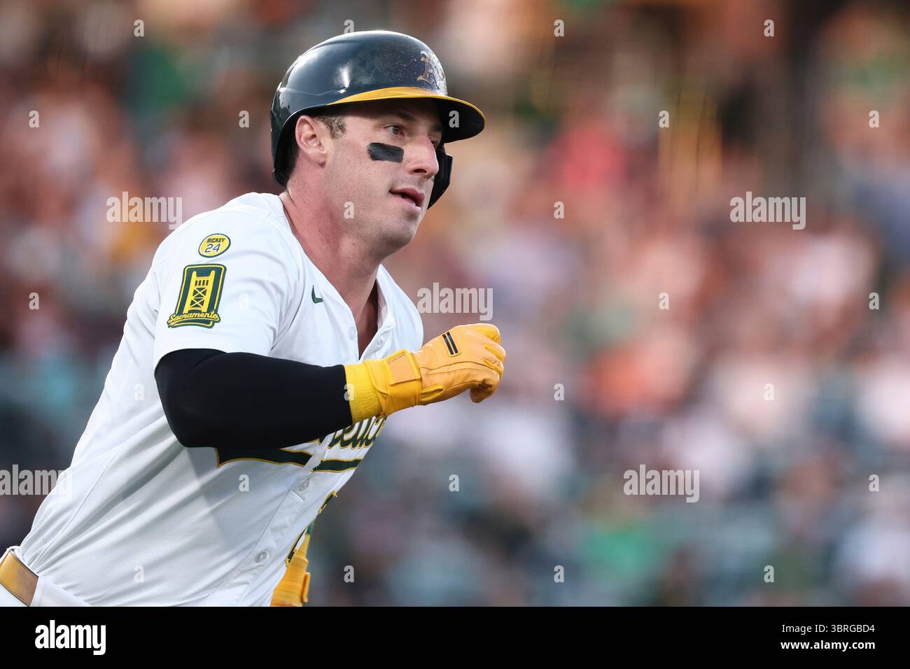 Athletics' Brent Rooker runs after hitting an RBI double during the ...