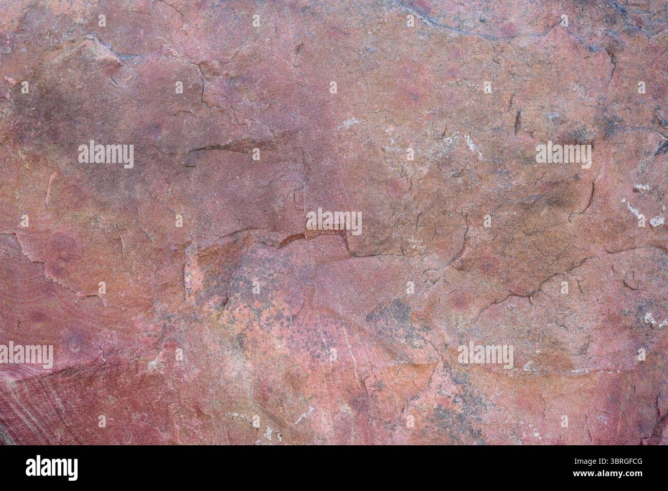 Intricate patterns reveal the vibrant colors of weathered stone layers ...