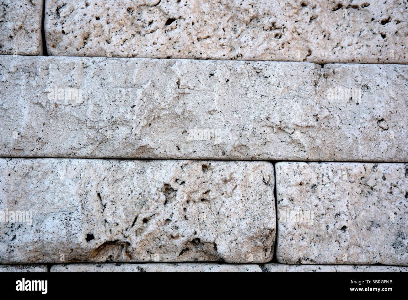 Rustic stone structure features unique textures and earthy tones Stock ...