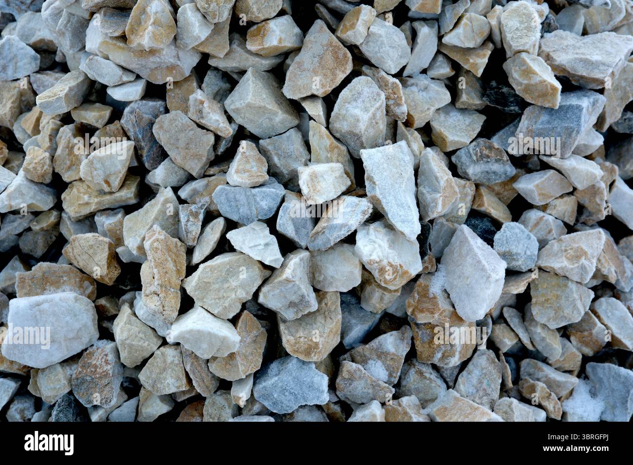 A collection of small stones waiting to be used in building projects ...